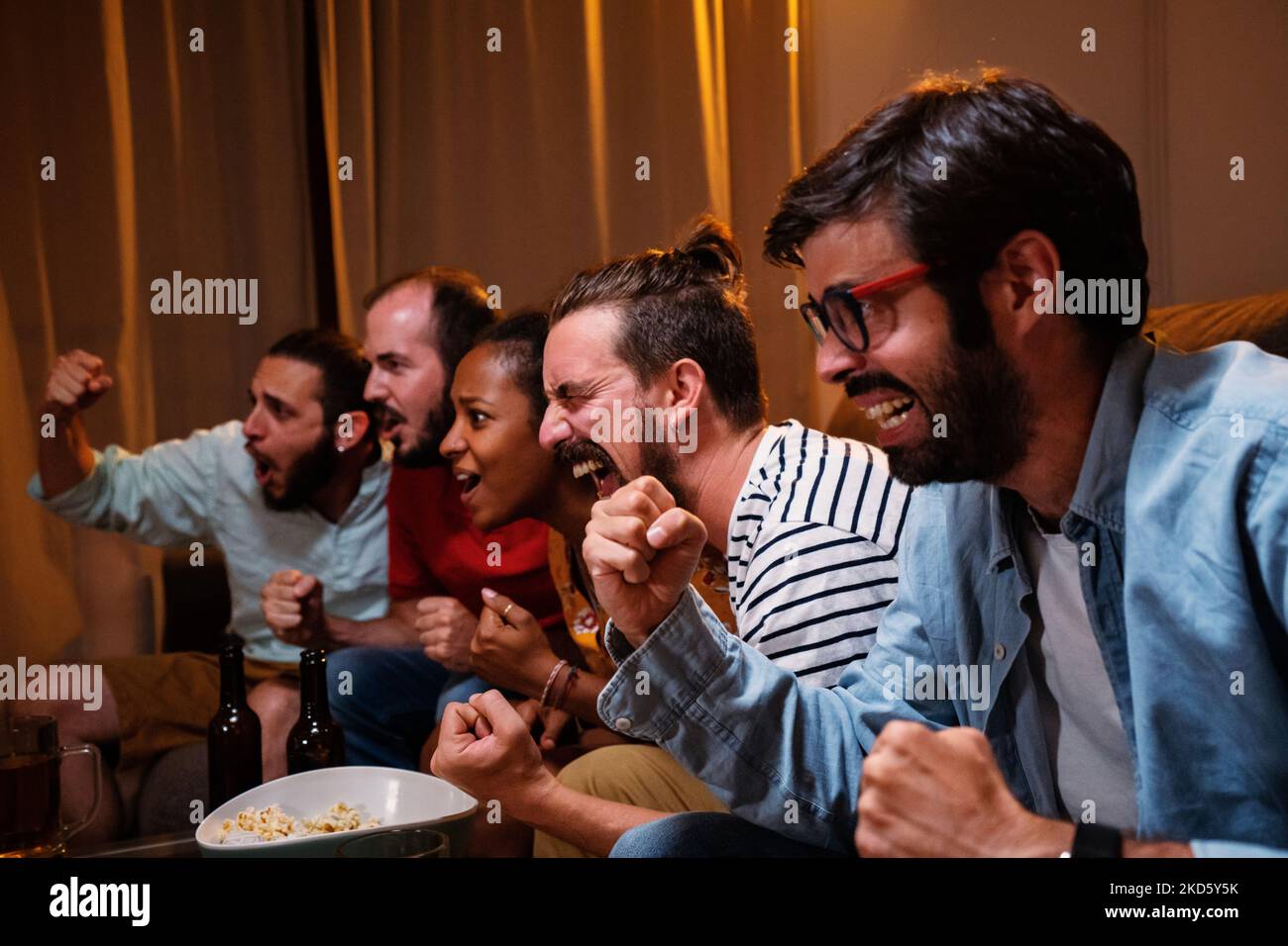 Group excited young male supporters hi-res stock photography and images ...