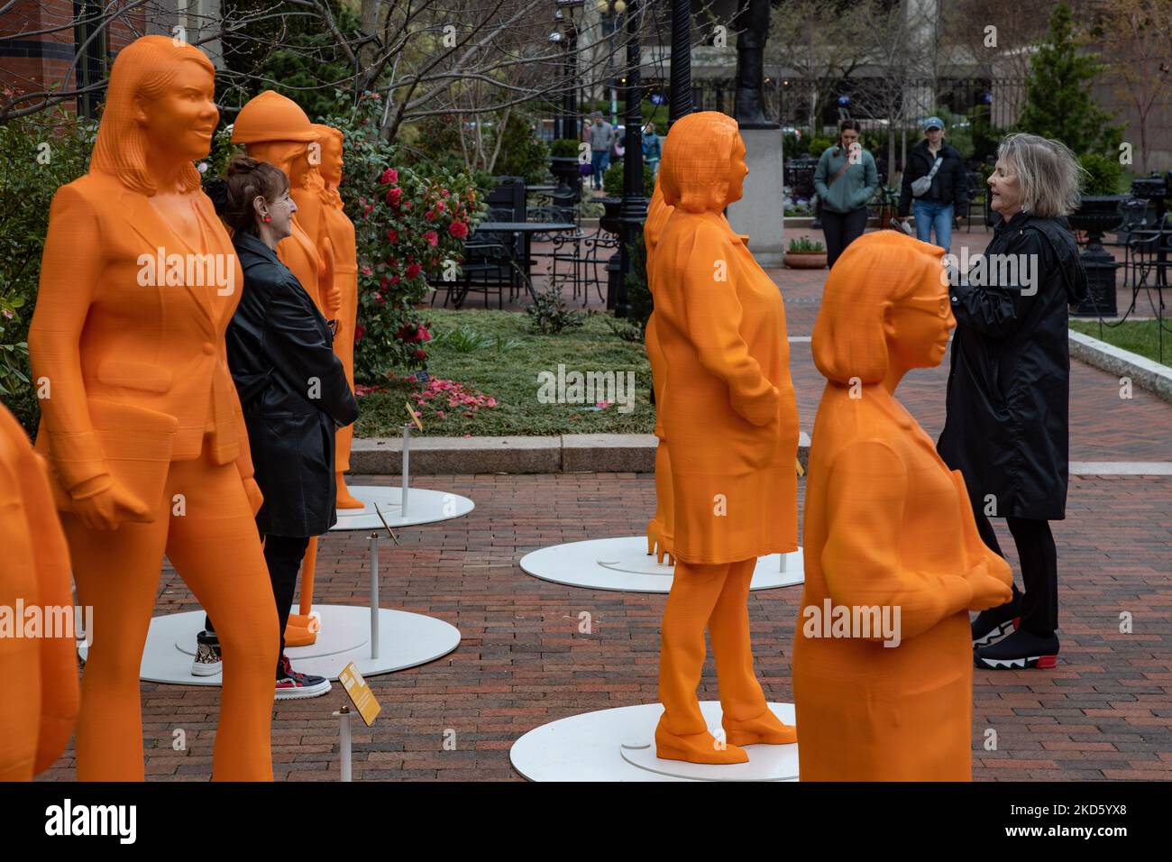 3-D printed orange statues celebrating contemporary women innovators in ...
