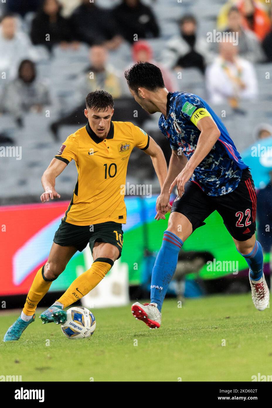 Ajdin Hrustic of the Socceroos is challenged by Maya Yoshida of Japan ...
