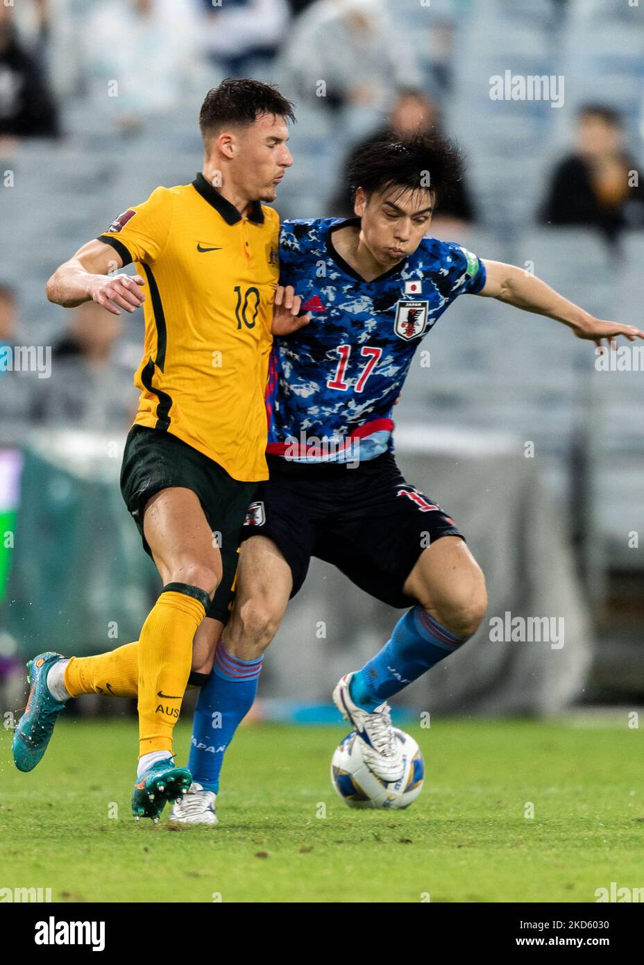 Miki Yamane of the Japan is challenged by Ajdin Hrustic of Australia ...