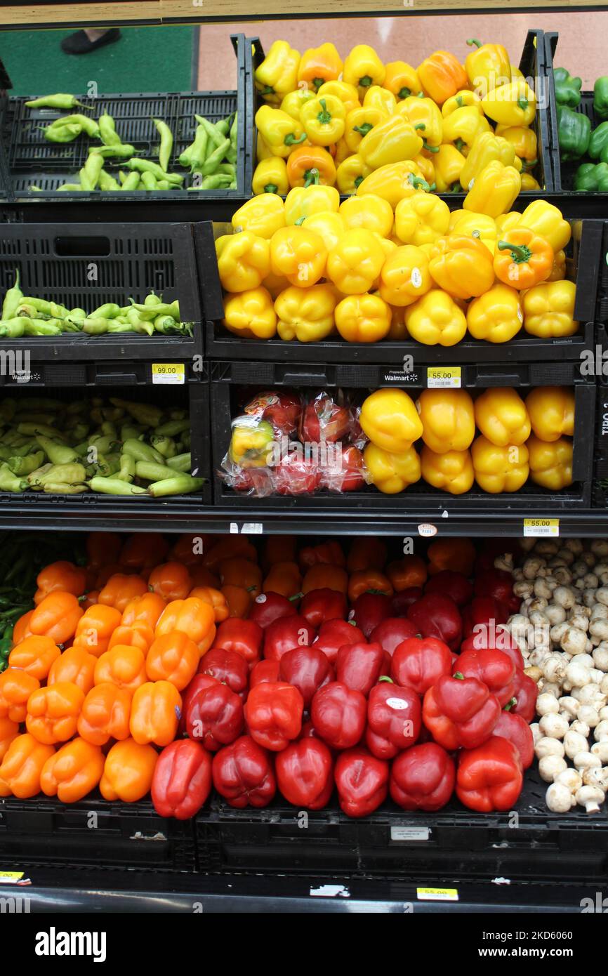 MERIDA, MEXICO - OCTOBER 2, 2016 red, yellow and orange bell peppers on ...