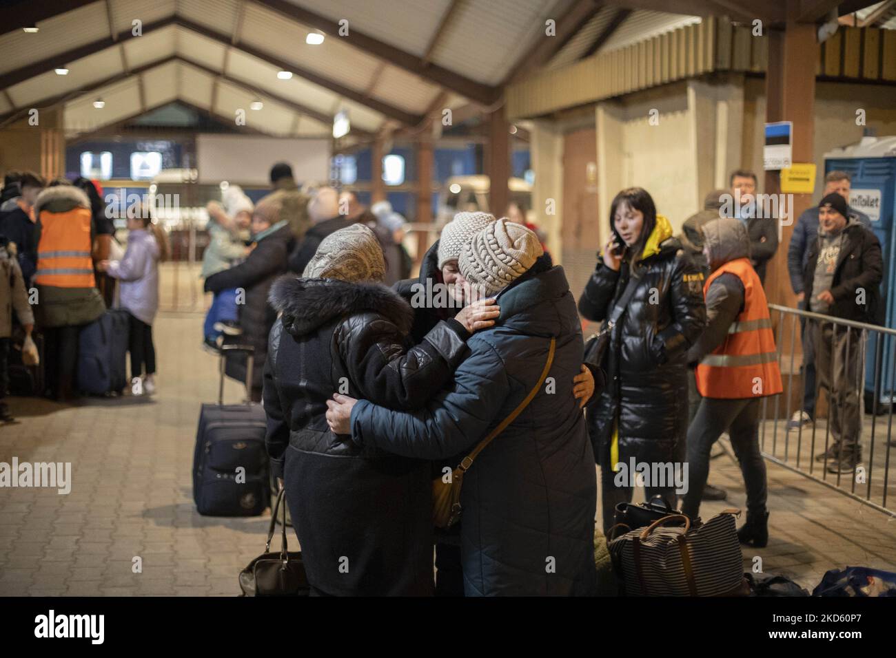 Old women cry and hug as they arrive safely in Poland. Refugees from ...