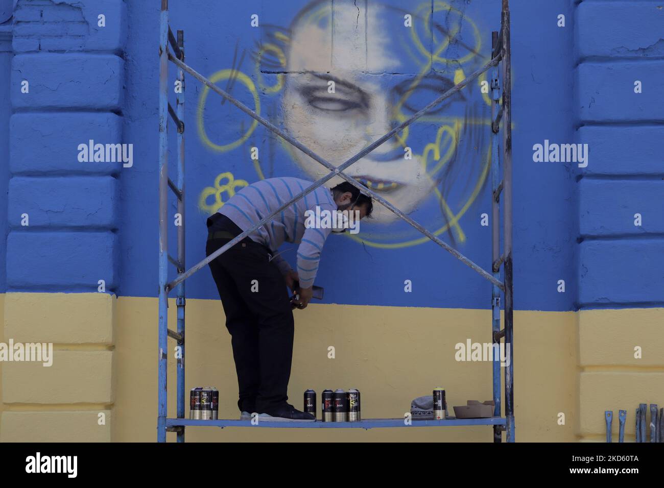 Urban artists create a mural outside Casa Picnic in Mexico City in ...