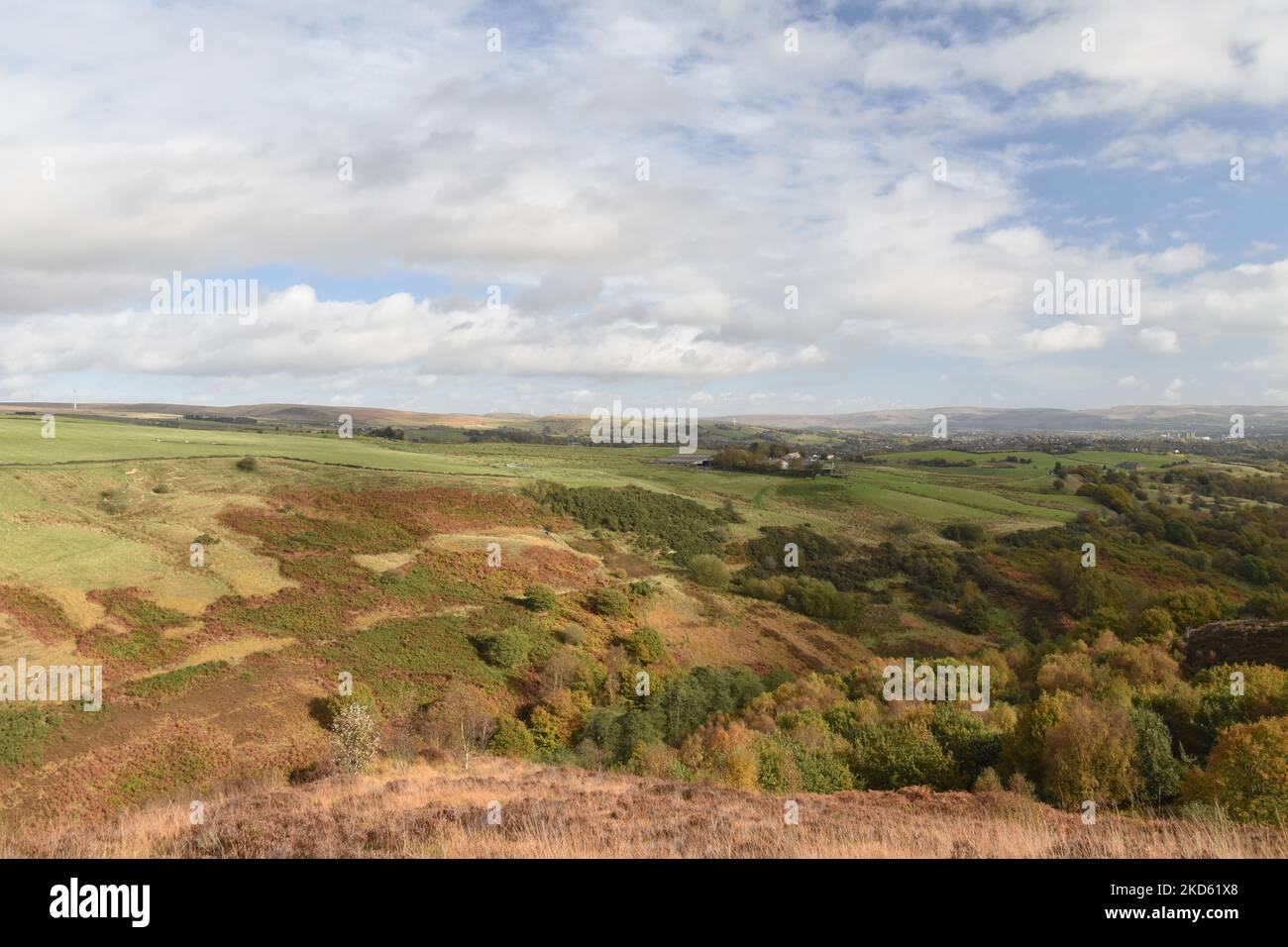 A green valley with a blue cloudy sky in the background, Bury ...
