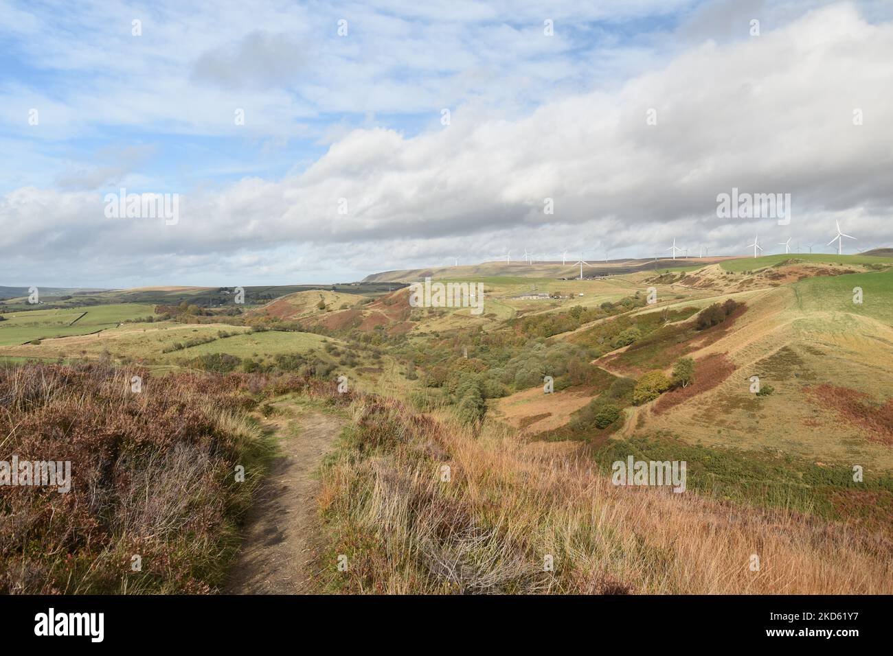 A green valley with a blue cloudy sky in the background, Bury ...