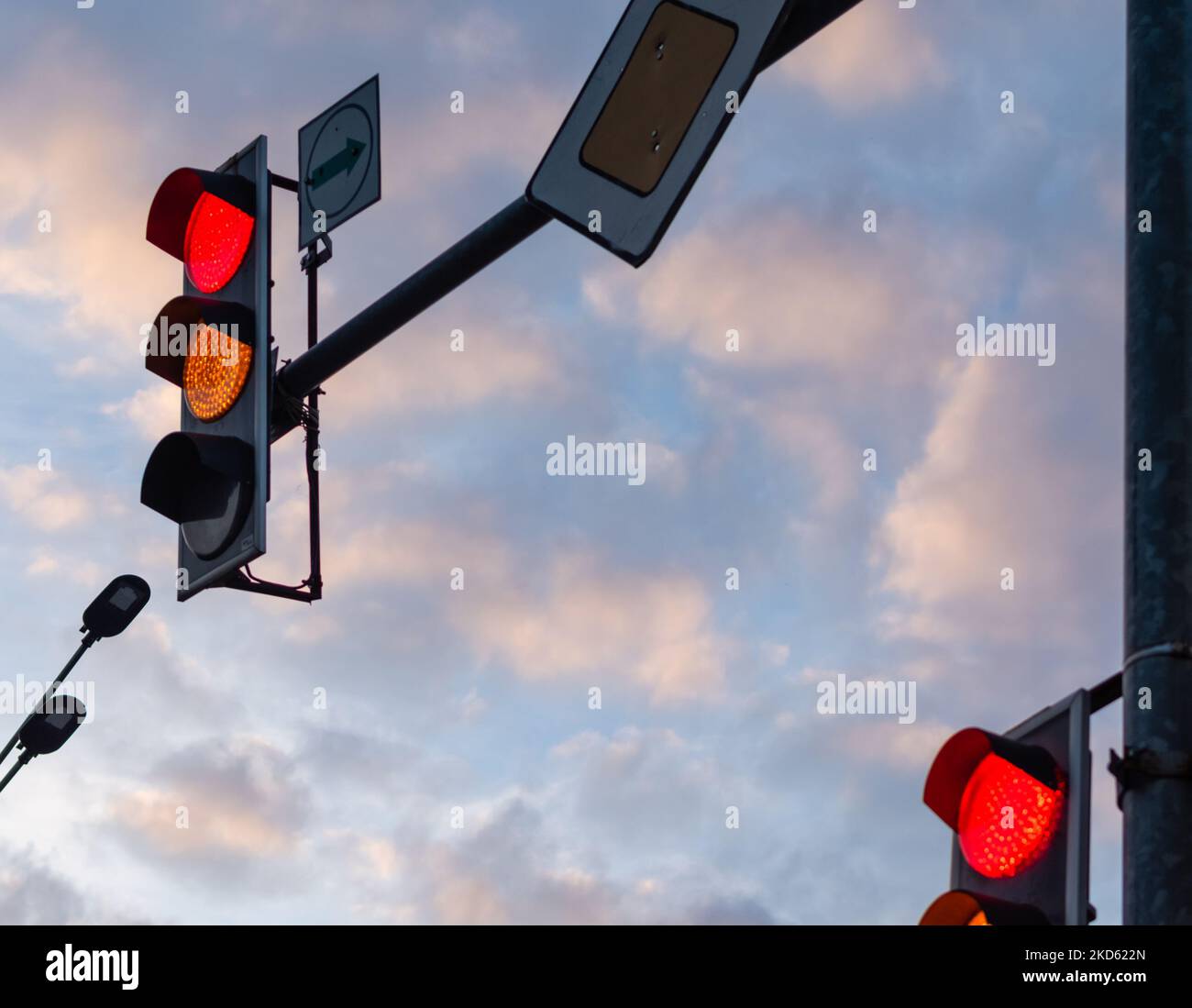 Traffic lights with red and yellow colors background of clouds at ...