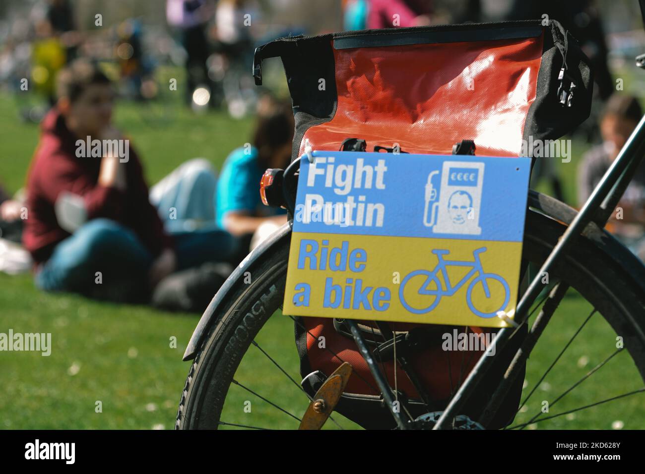 a sign of " fight putin and ride bicycle" is seen during the Fridays ...