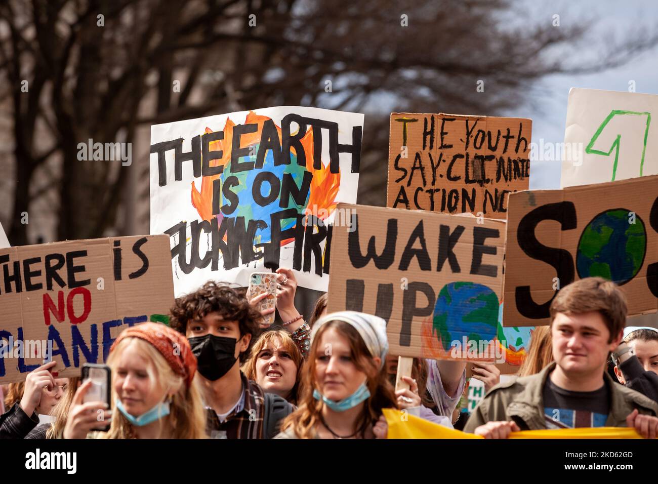 Protesters march to the Capitol during a strike against climate change ...