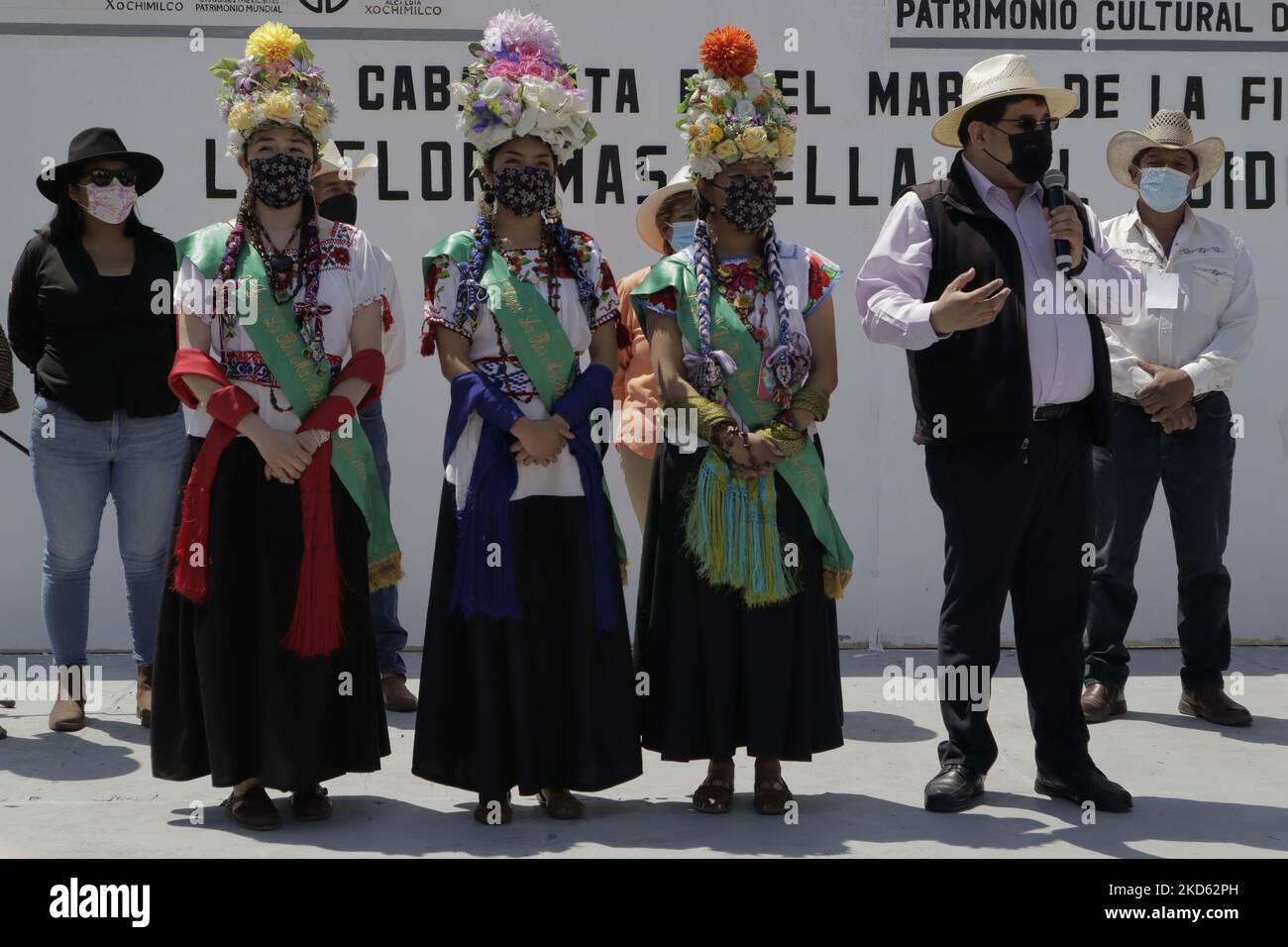 With a crown of flowers and typical costume, native women from ...