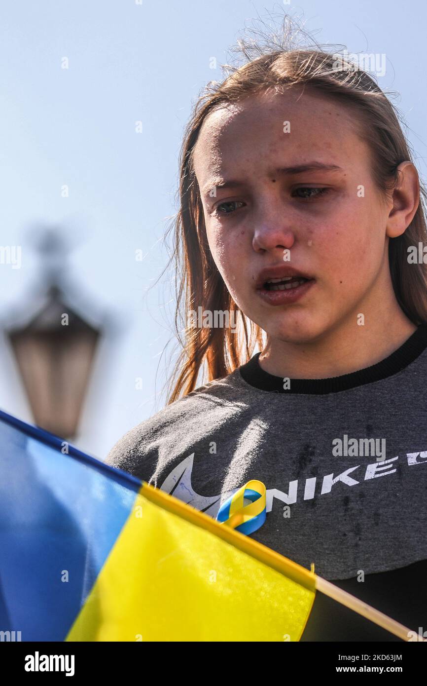 A child is seen crying while attending a demonstration of solidarity ...