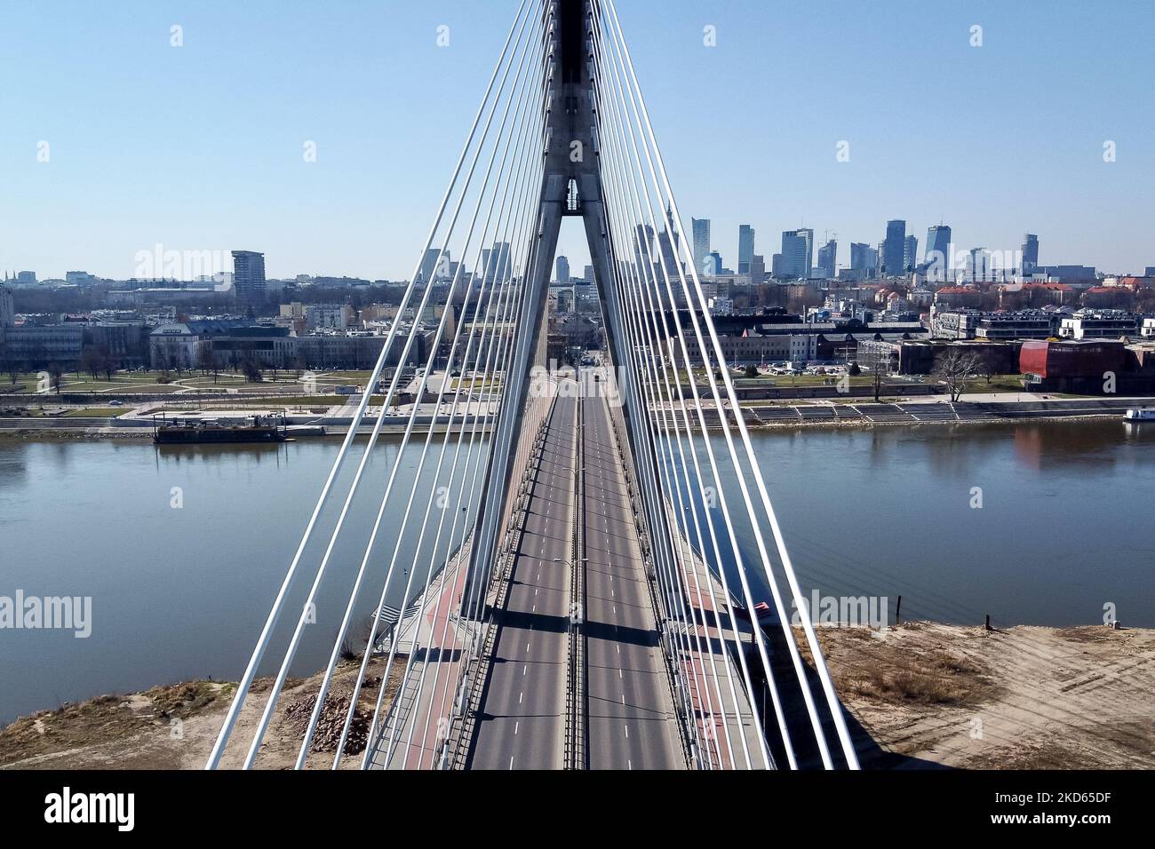 A drone view of Swietokrzyski Bridge and downtown in the background, in ...
