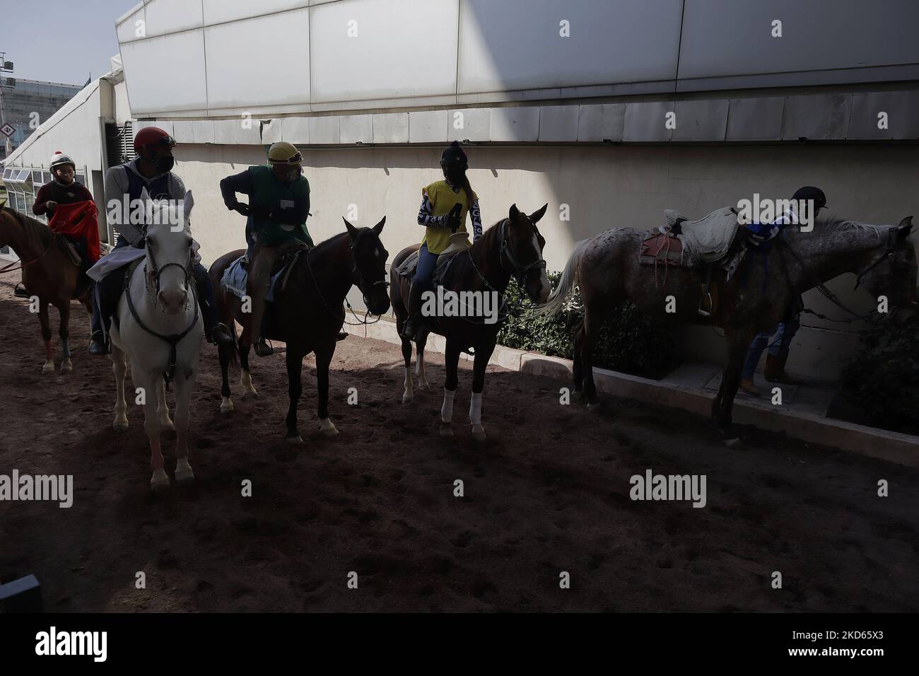 A group of horses and jockeys prior to a race during the commemoration ...