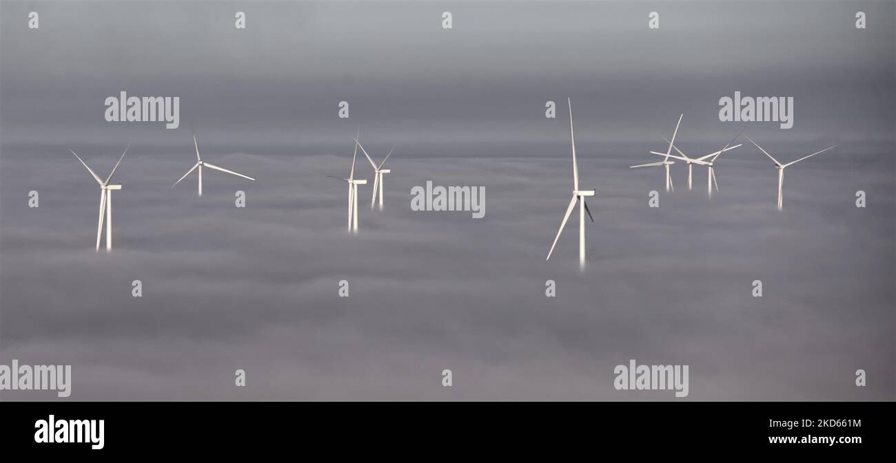 The wind turbines in the fog Stock Photo - Alamy