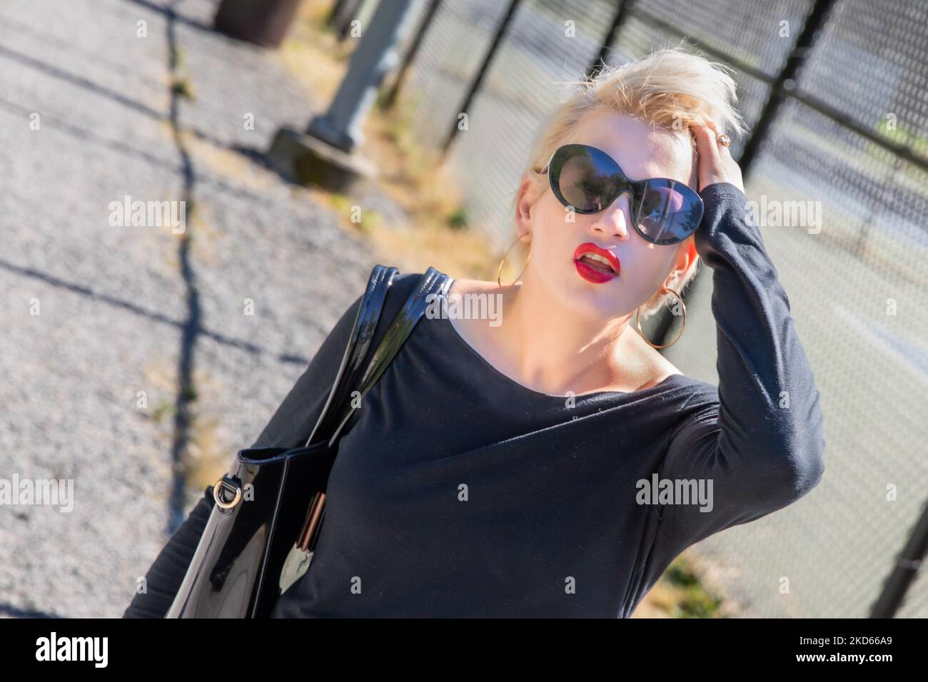 Pretty woman looking cool Stock Photo - Alamy