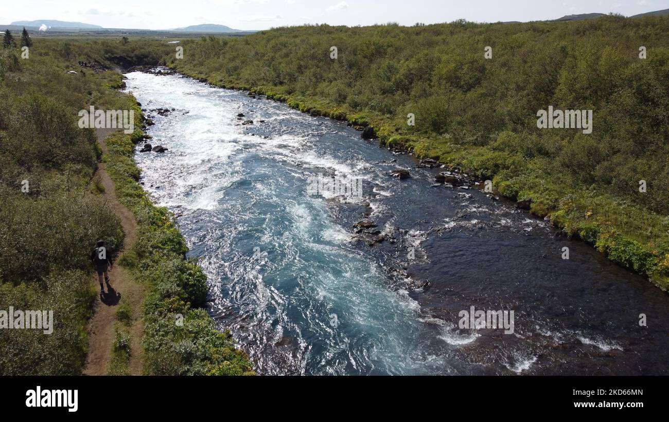 An aerial view of a river flowing through mountains Stock Photo - Alamy
