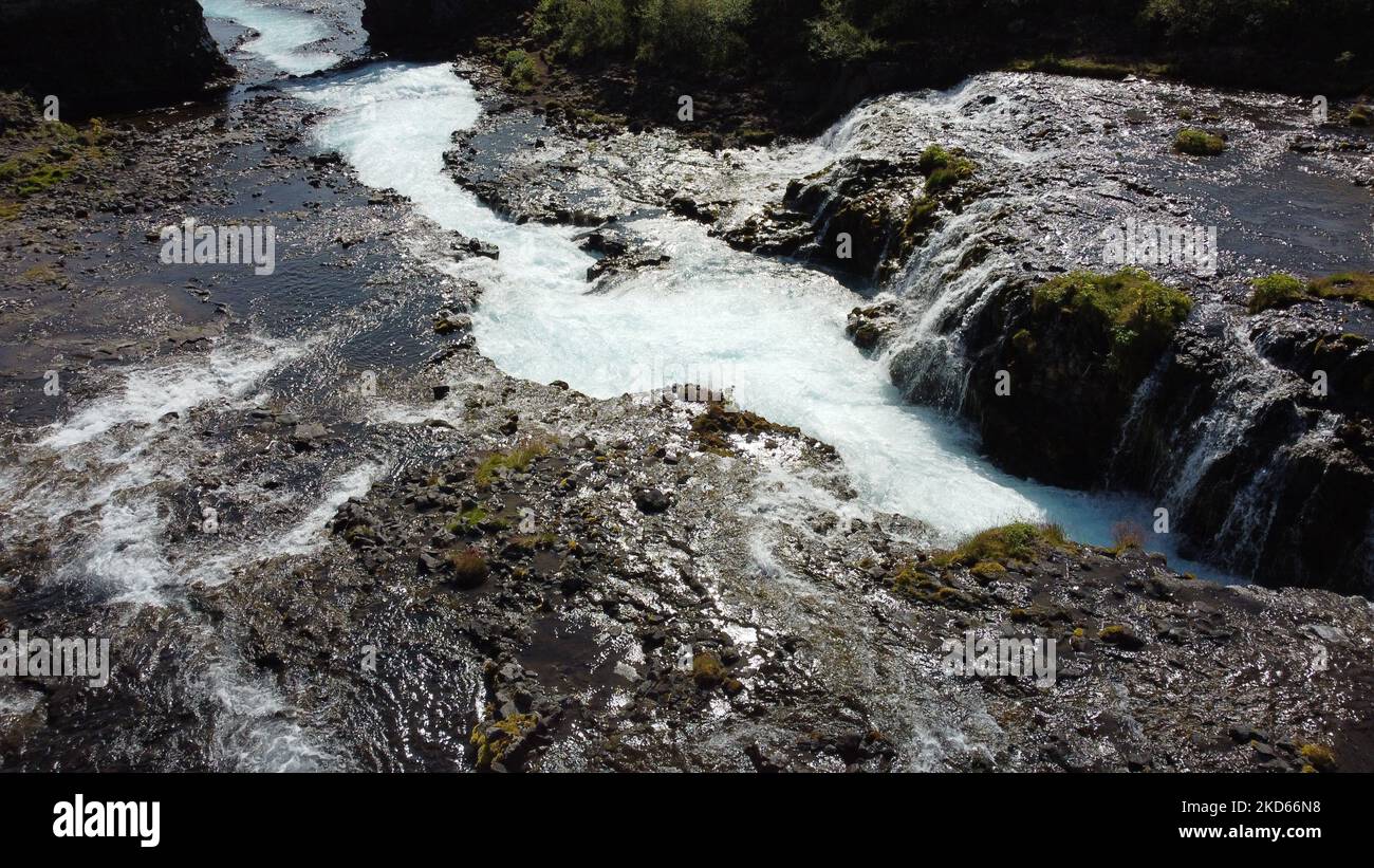 An aerial view of a river flowing through mountains Stock Photo - Alamy