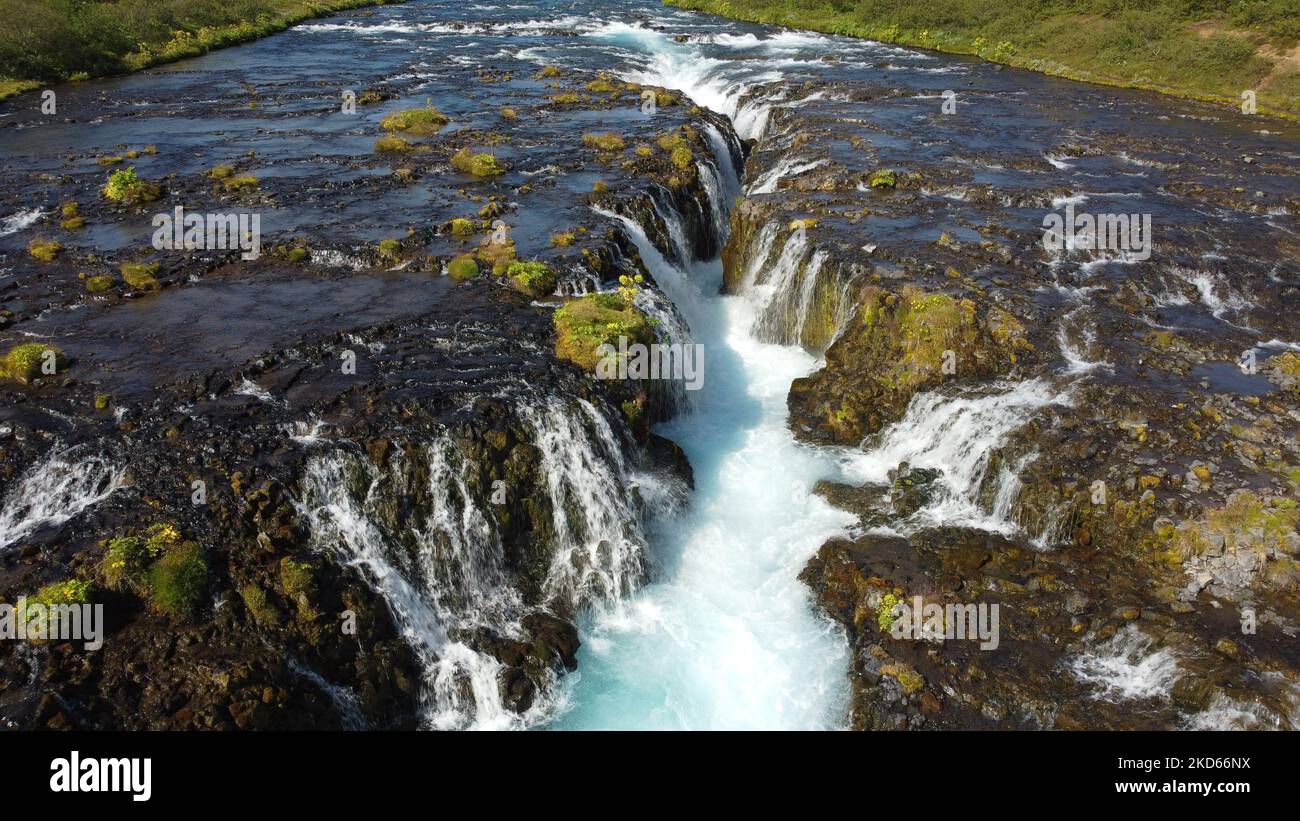An aerial view of a river flowing through mountains Stock Photo - Alamy