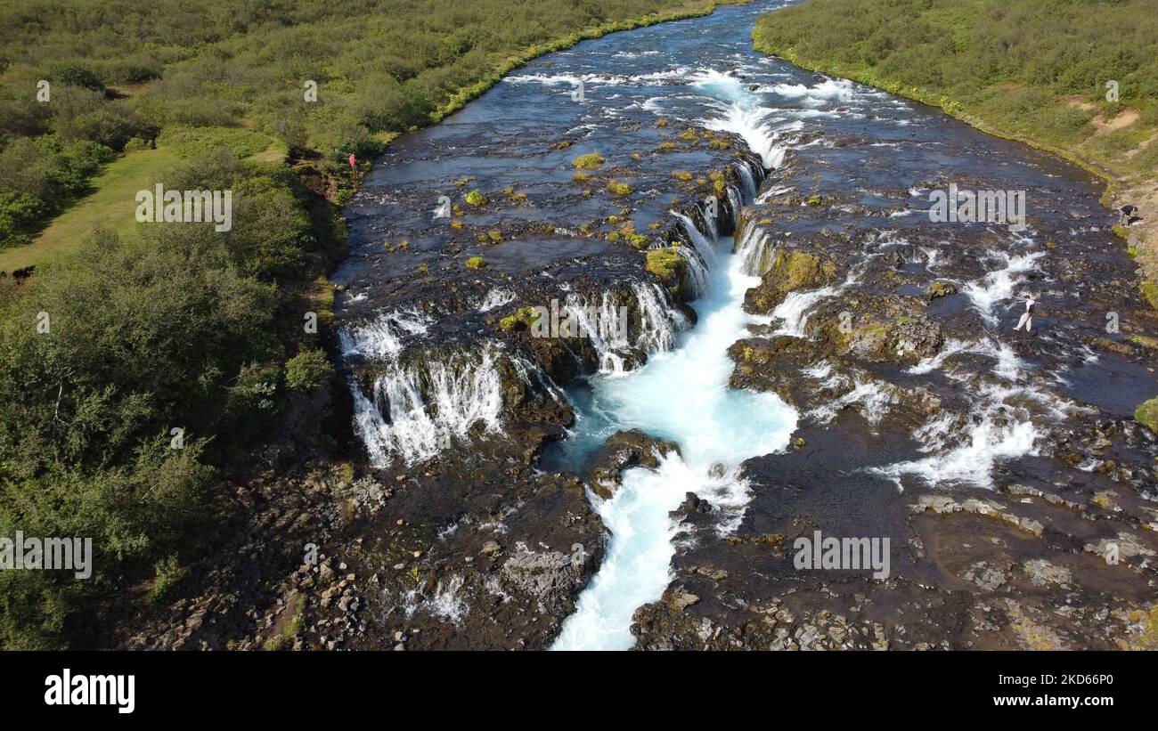 An aerial view of a river flowing through mountains Stock Photo - Alamy