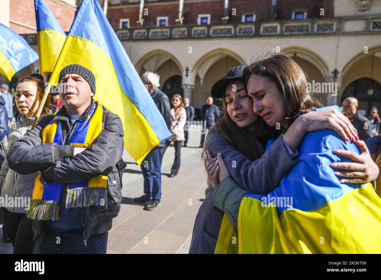 Two Young Women Embrace While Attending A Demonstration Of Solidarity