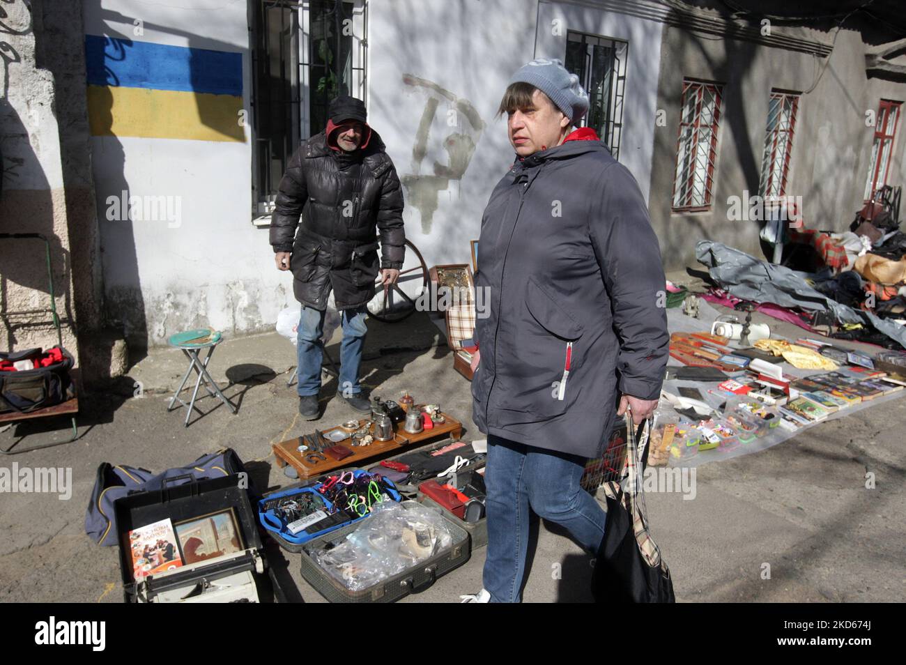 Ukrainians shop at a local flea market of the Starokinny Rynok, amid ...