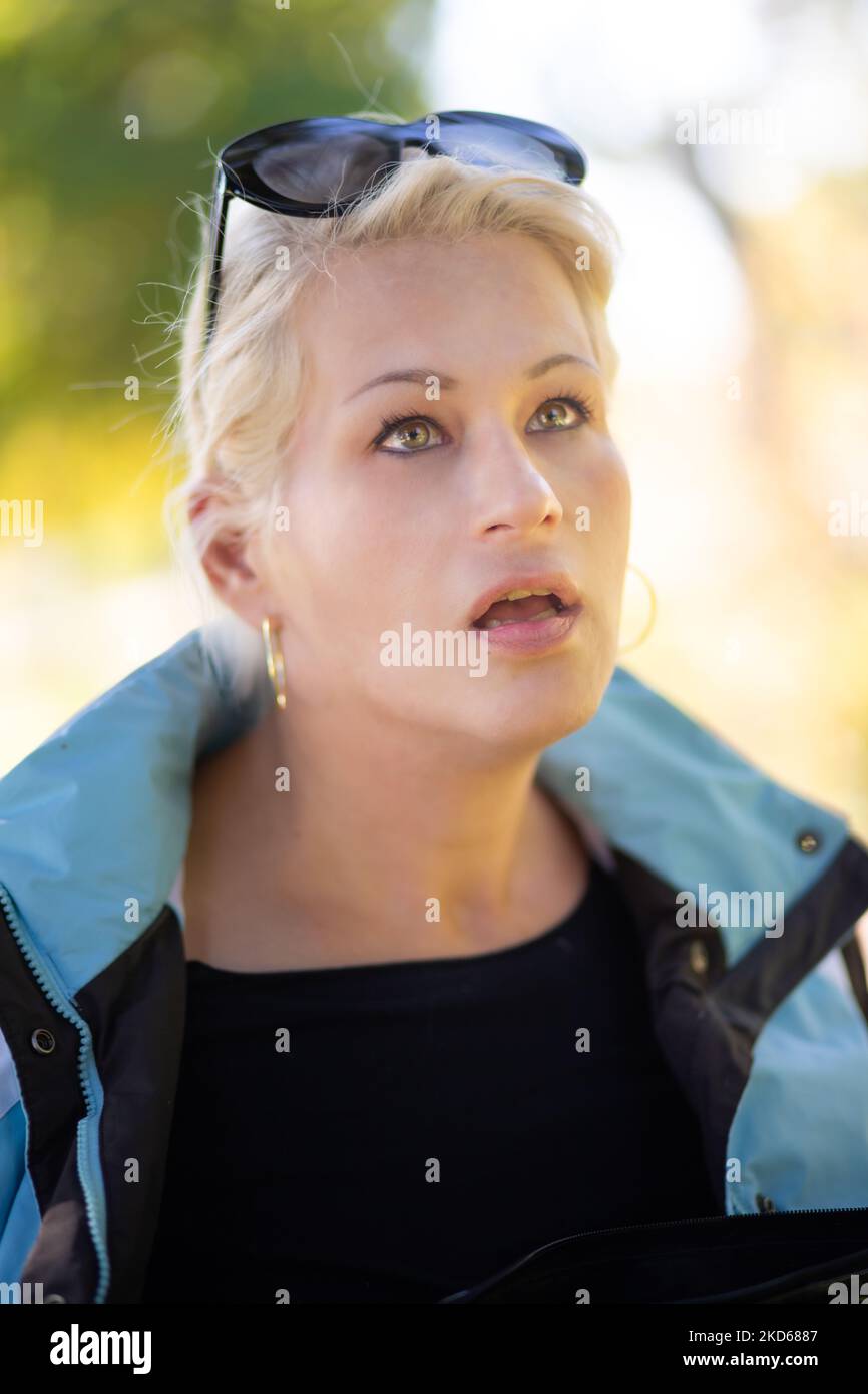 Pretty woman looking bewildered Stock Photo - Alamy