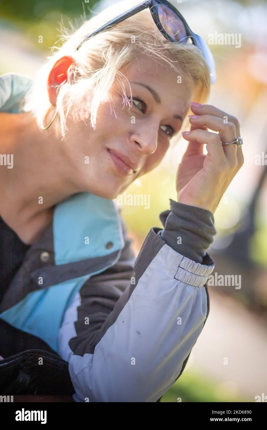 Pretty woman looking happy Stock Photo - Alamy