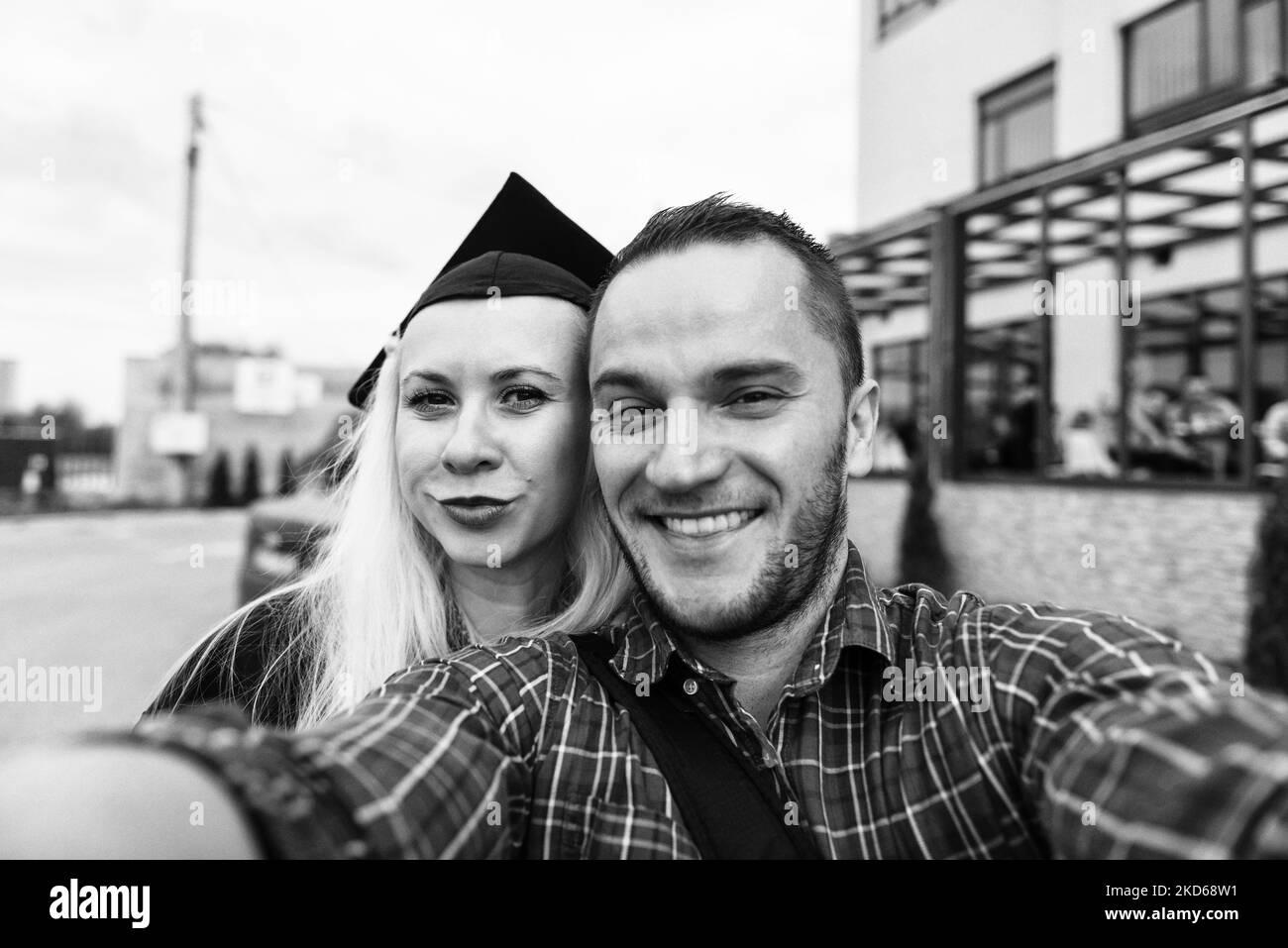 Graduation couple celebrating man Black and White Stock Photos & Images ...