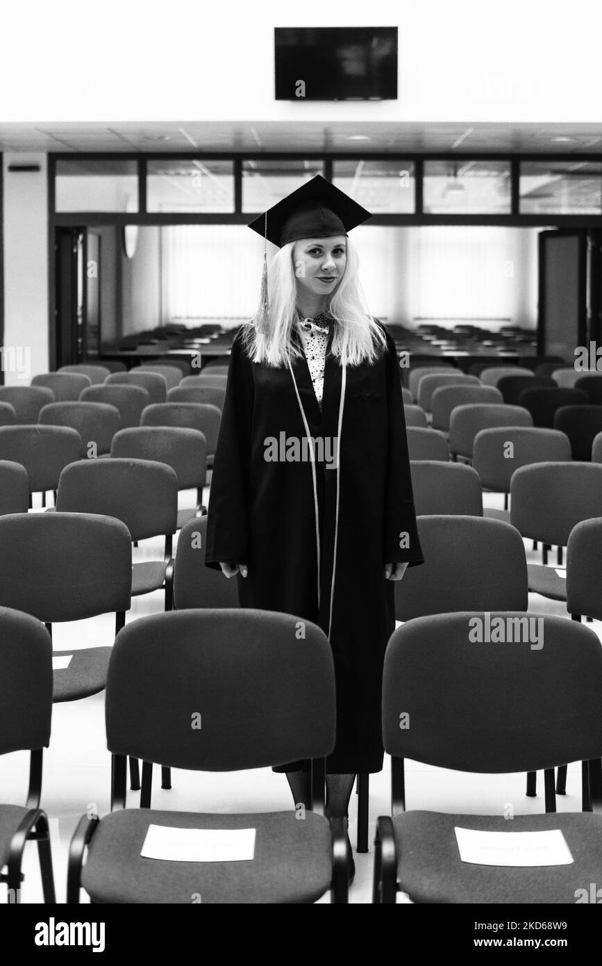 Young Happy Woman University Graduates in Graduation Gown and Cap to ...