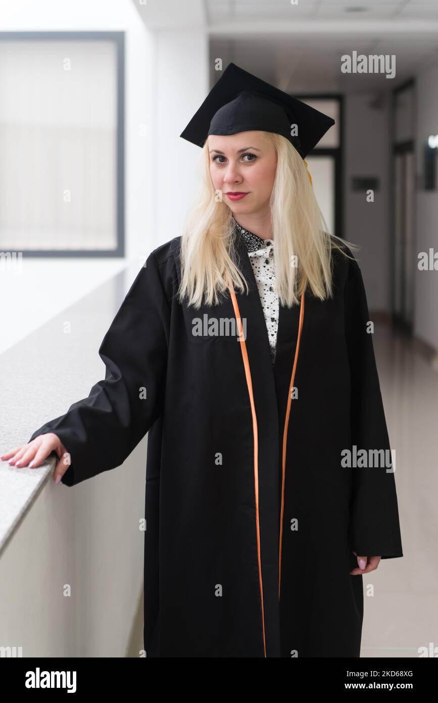 Female Blonde College or High School Graduate Confidently Wearing Black ...