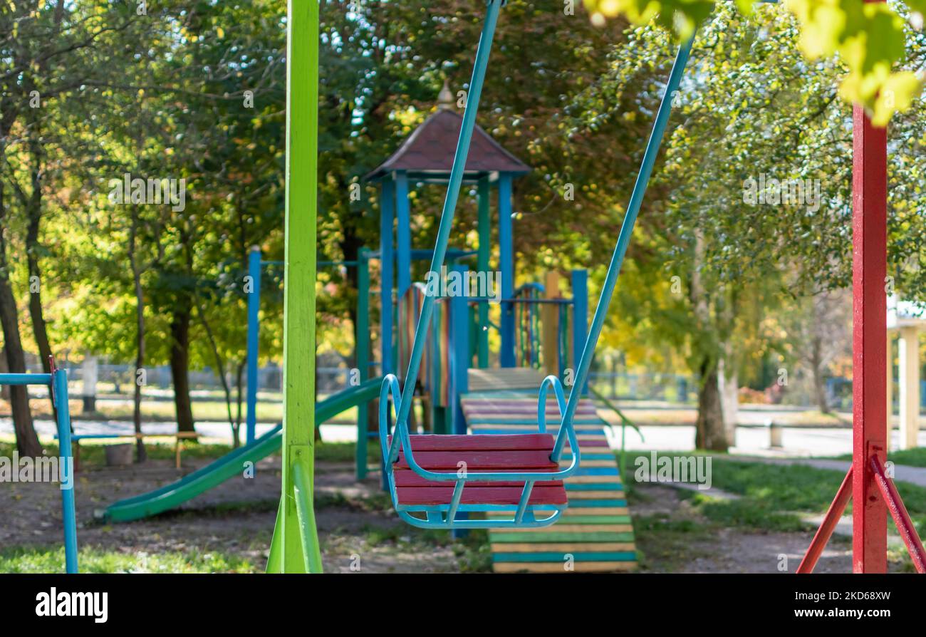 Bright multi-colored playground in courtyard of multi-storey buildings ...