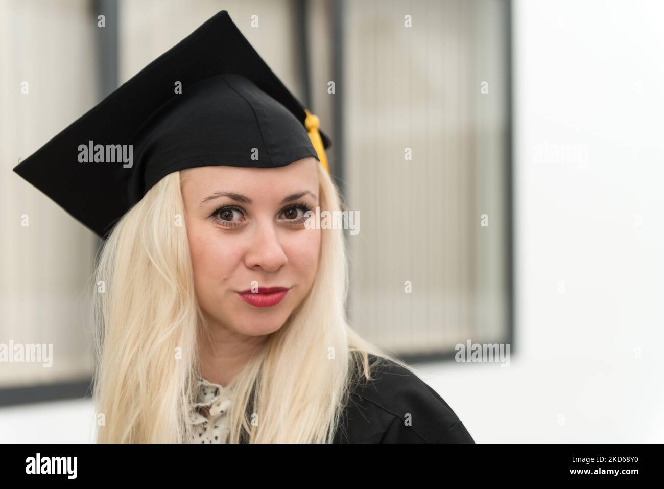 Young Happy Woman University Graduates in Graduation Gown and Cap to ...