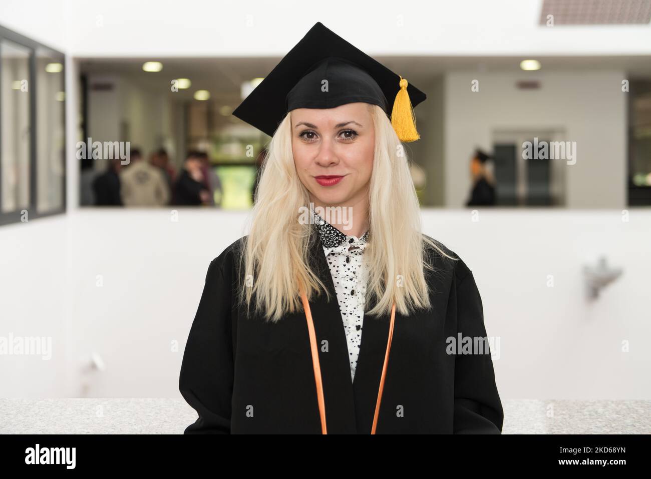 Young Happy Woman University Graduates in Graduation Gown and Cap to ...