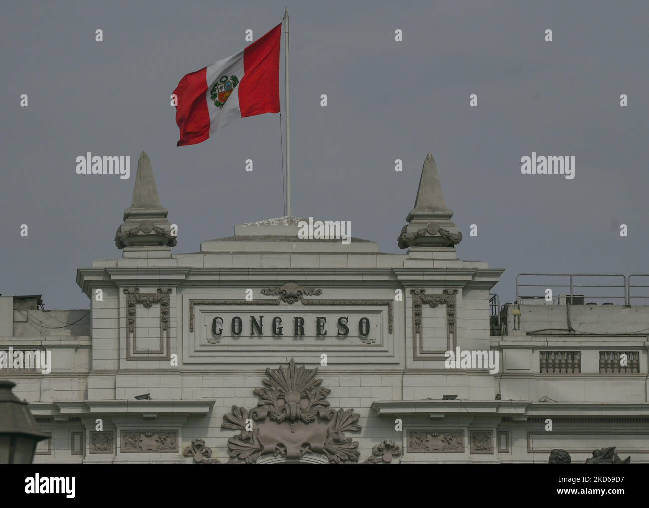 The Peruvian national flag flies over the building of the Congress of ...