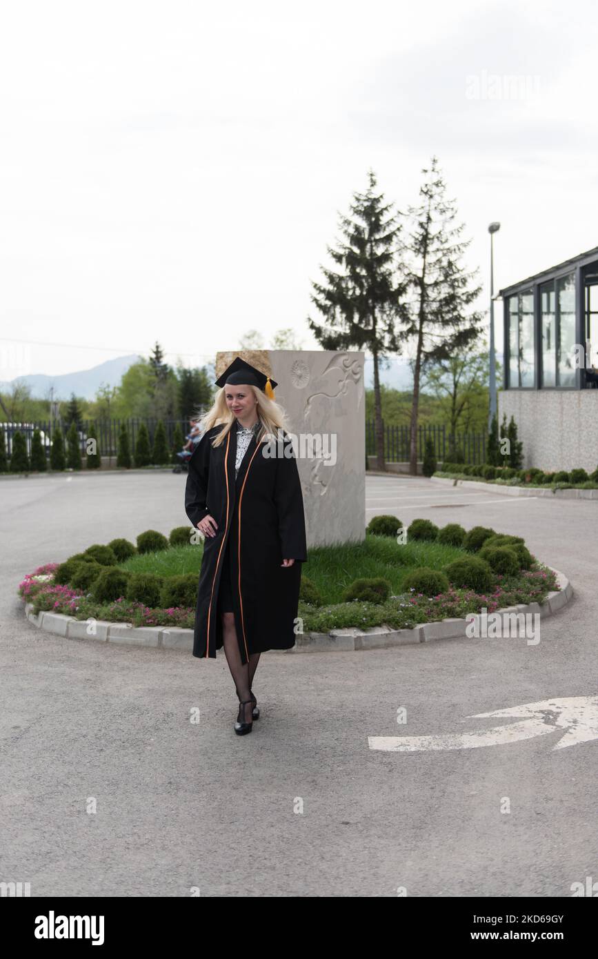 Female Blonde College or High School Graduate Confidently Wearing Black ...