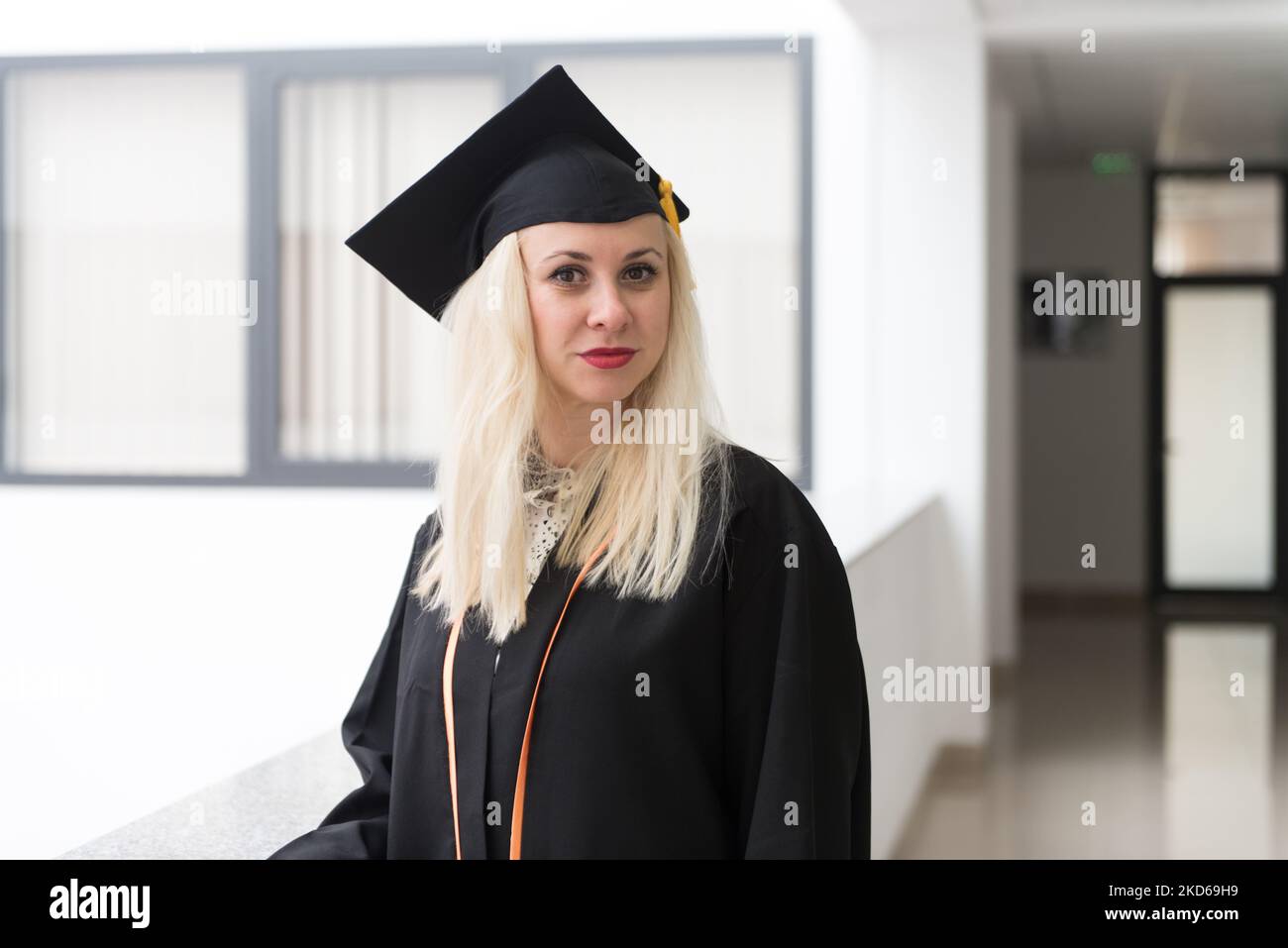 Female Blonde College or High School Graduate Confidently Wearing Black ...