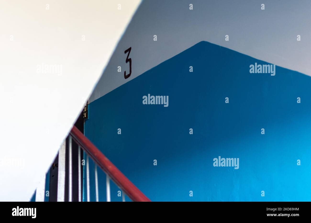 Interior of multi-storey residential building with stairs between ...