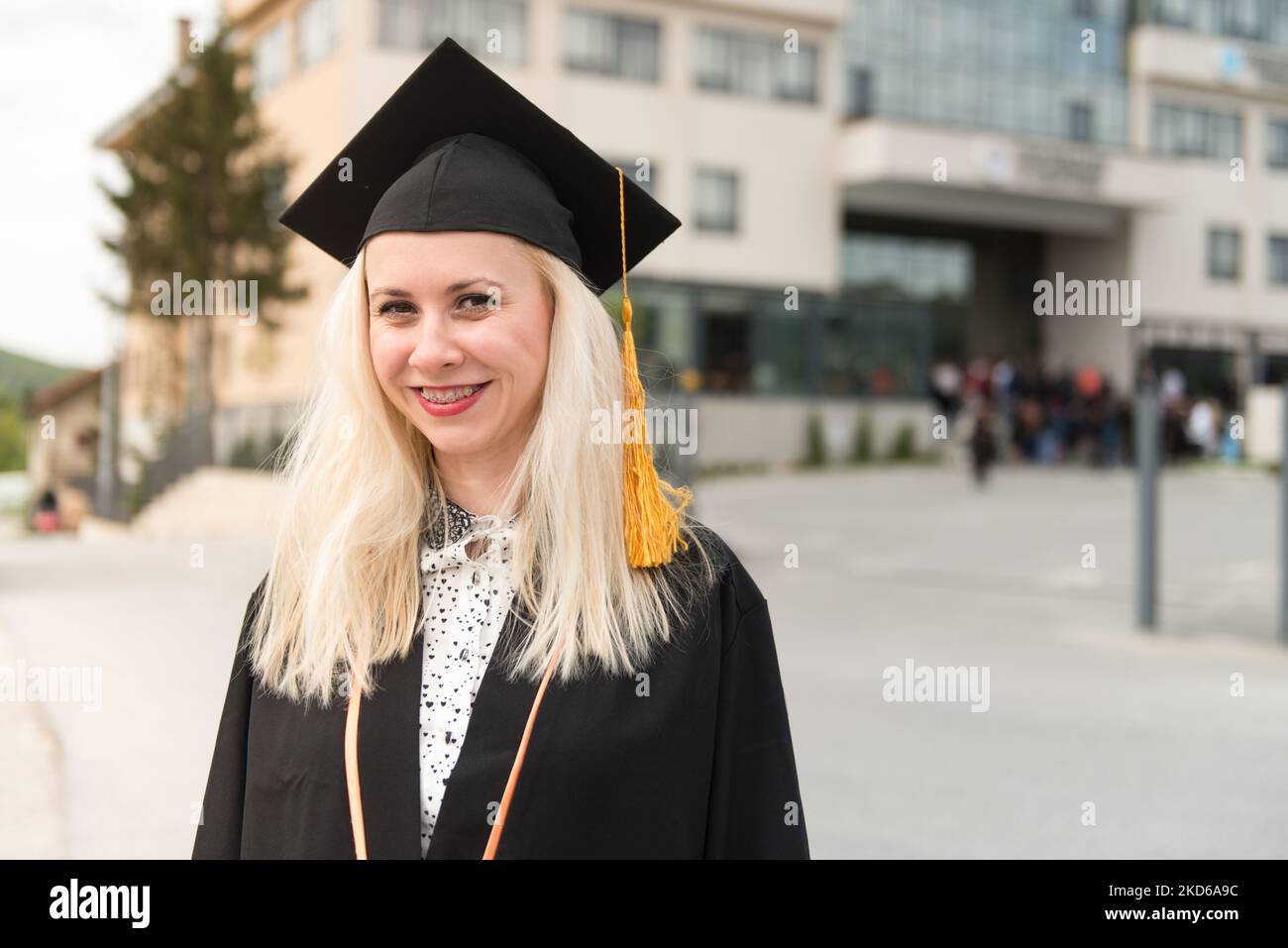 Happy Cute Blonde Caucasian Grad Girl is Smiling - She is in a Black ...