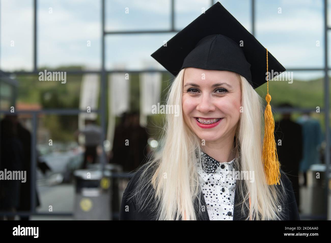 Happy Cute Blonde Caucasian Grad Girl is Smiling - She is in a Black ...