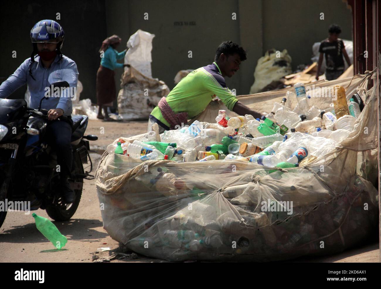 Used plastic bottles are seen at a rag picker unit as it process to ...