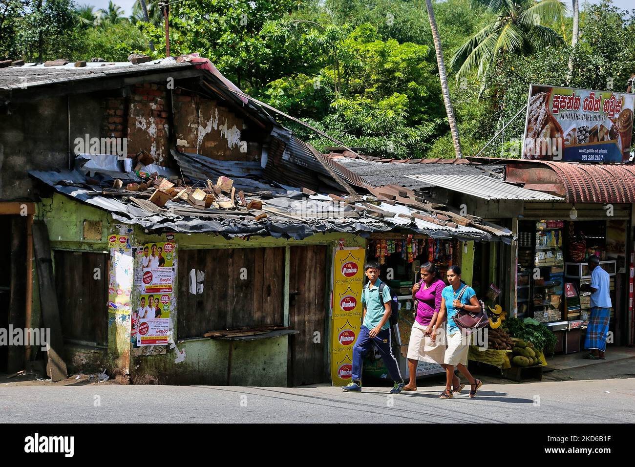 People walk past shops in the town of Matale in Sri Lanka. (Photo by ...