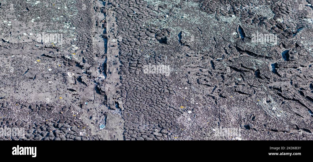 Old cracked black resin surface on roof of house for renovation Stock ...