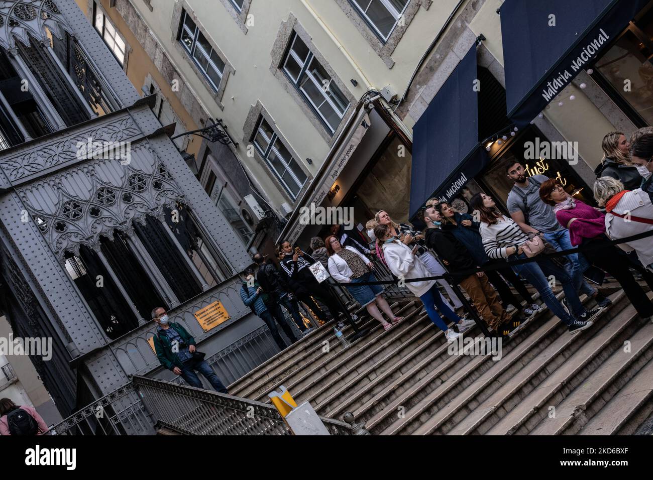 People queue for take the Elevador de Santa Justa, in Lisbon, Portugal ...