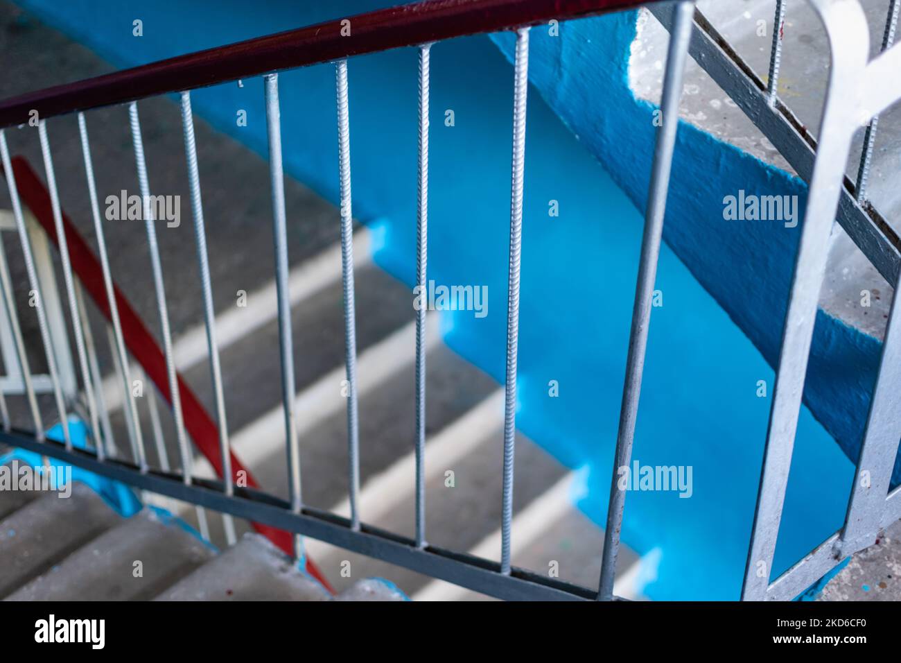 Interior of multi-storey residential building with stairs between ...