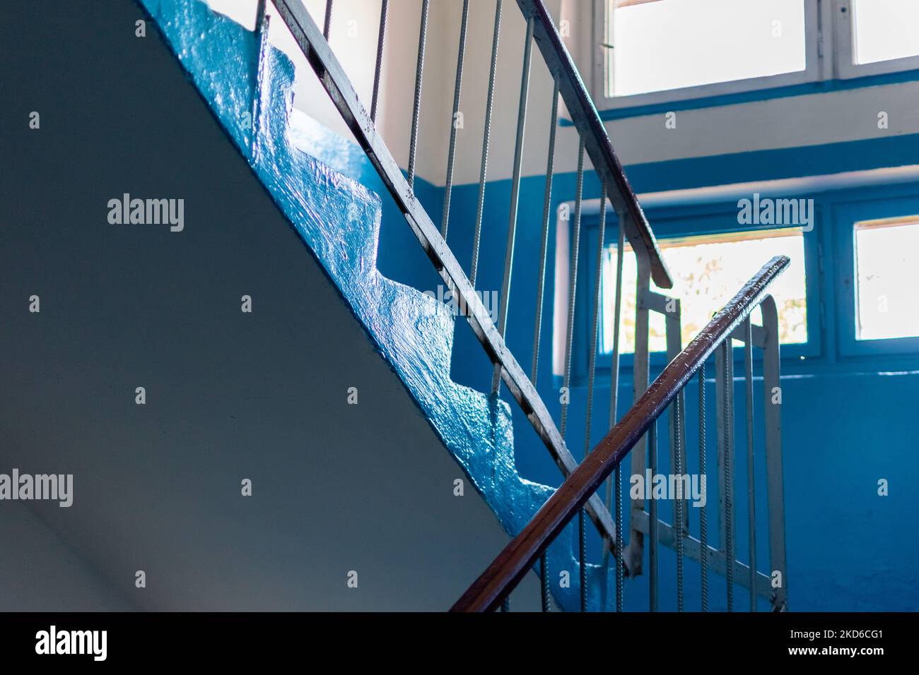 Interior of multi-storey residential building with stairs between ...