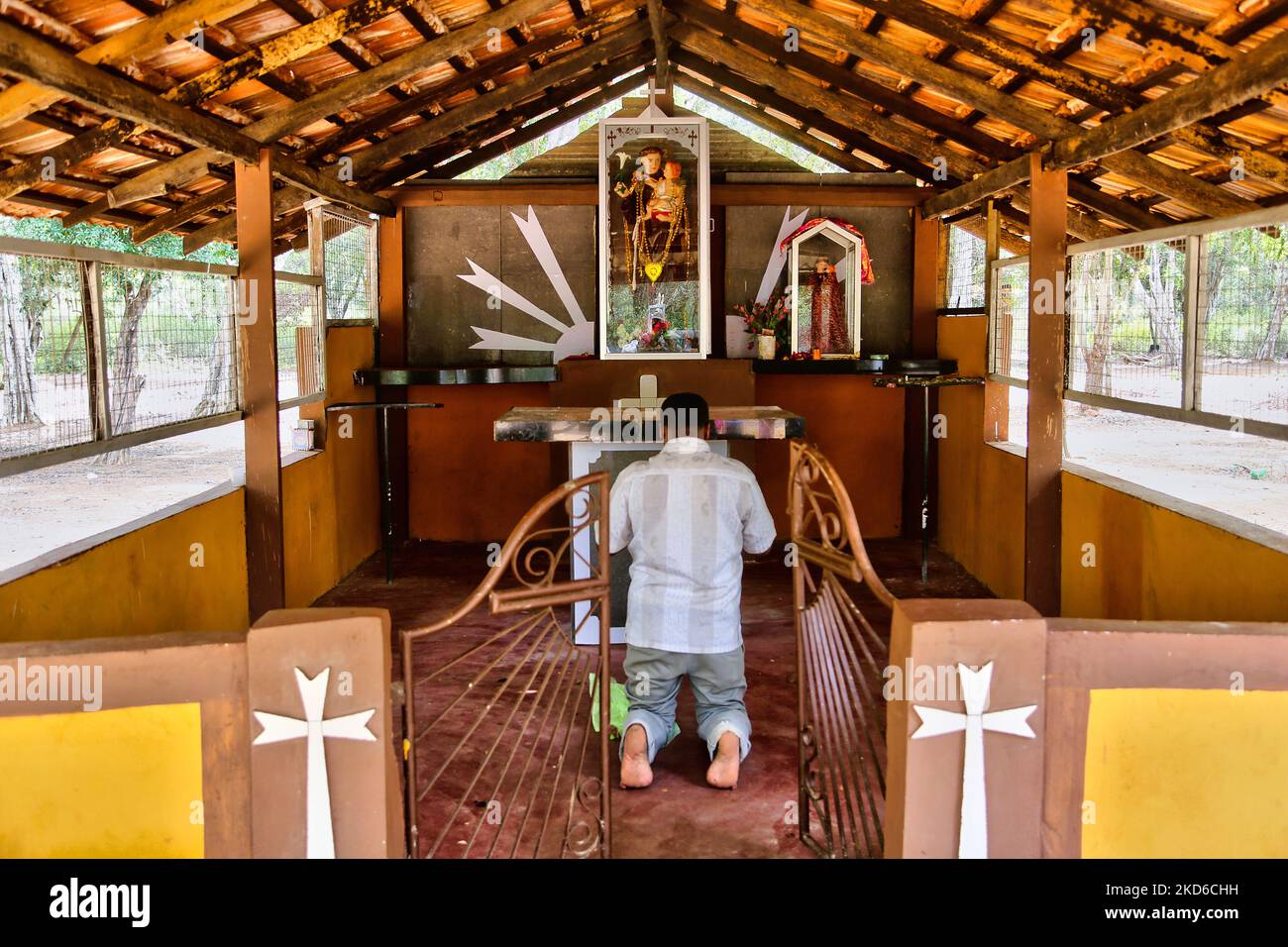 Tamil Catholic devotee offers prayers at a small church in Mannar, Sri ...