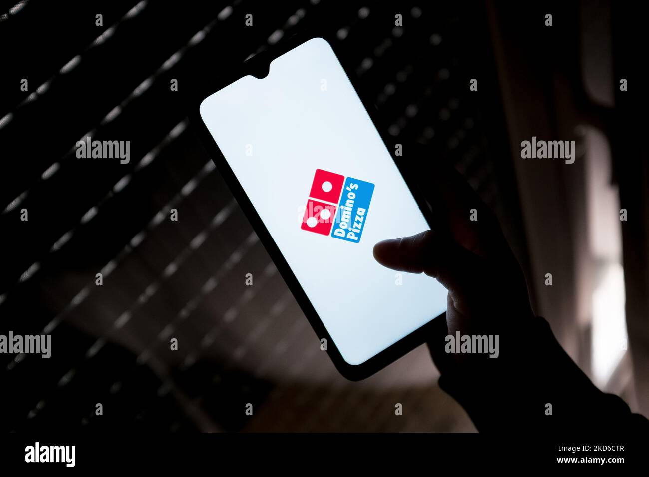 In this photo illustration a Domino’s Pizza logo seen displayed on a ...
