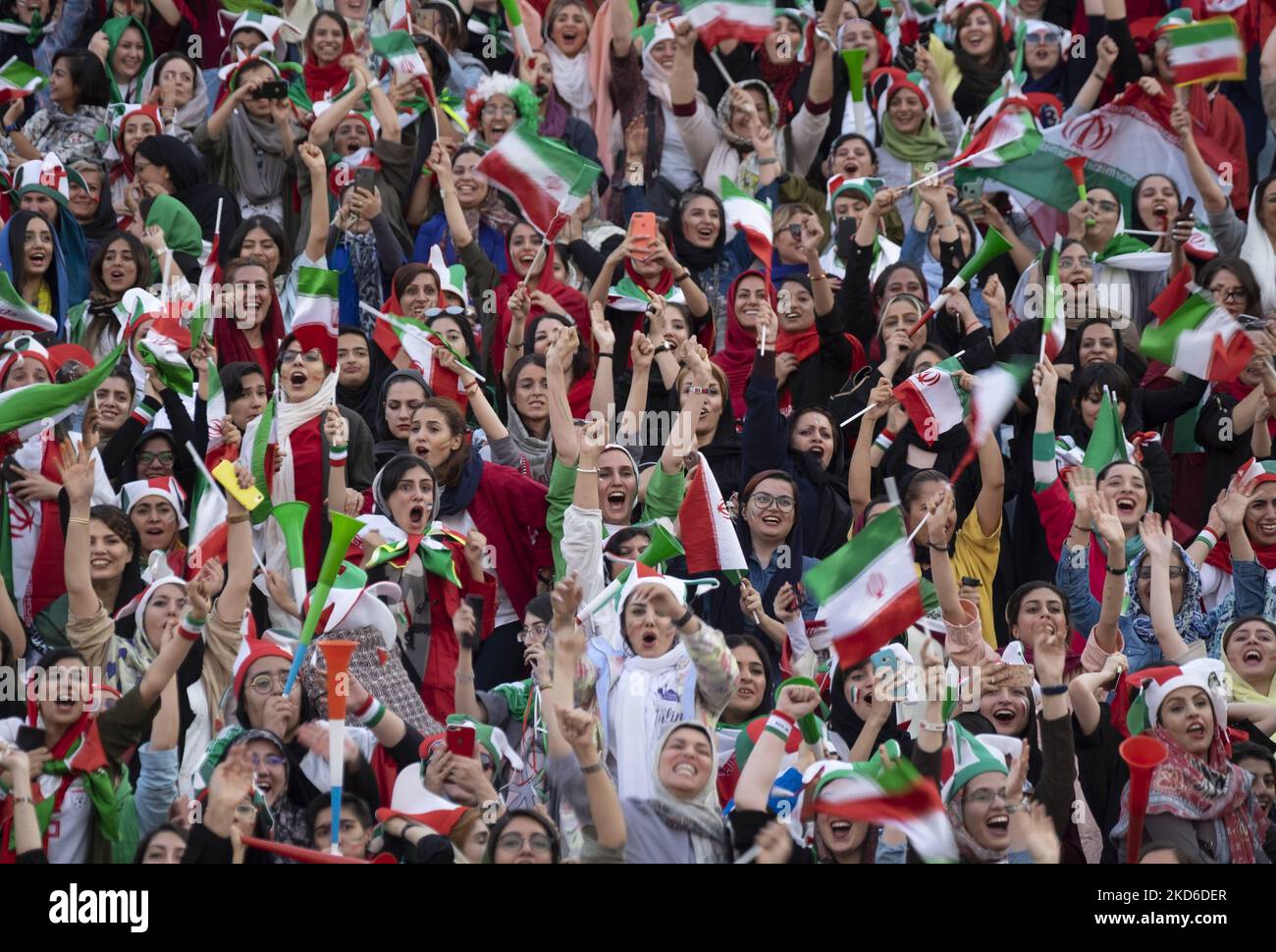 Iranian soccer female fans react as they attend the Azadi (Freedom ...