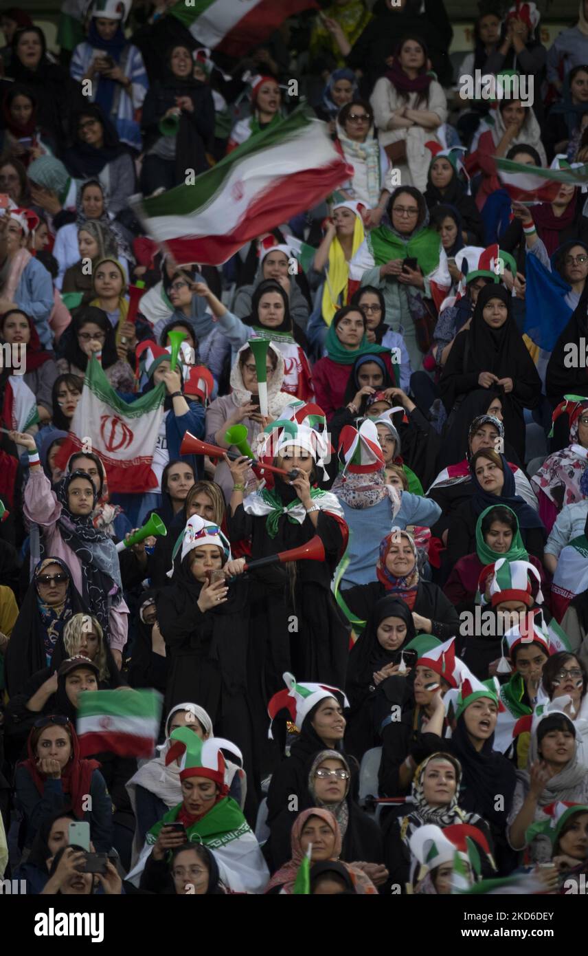 An Iranian soccer female fan (C) plays horn at the Azadi (Freedom ...