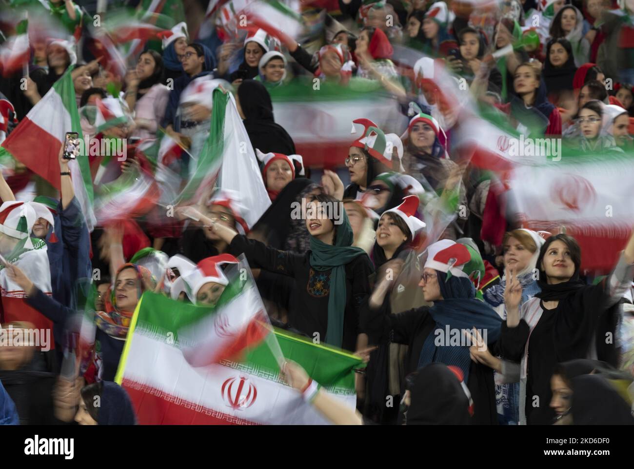 Iranian soccer female fans wave Iran flags at the Azadi (Freedom ...