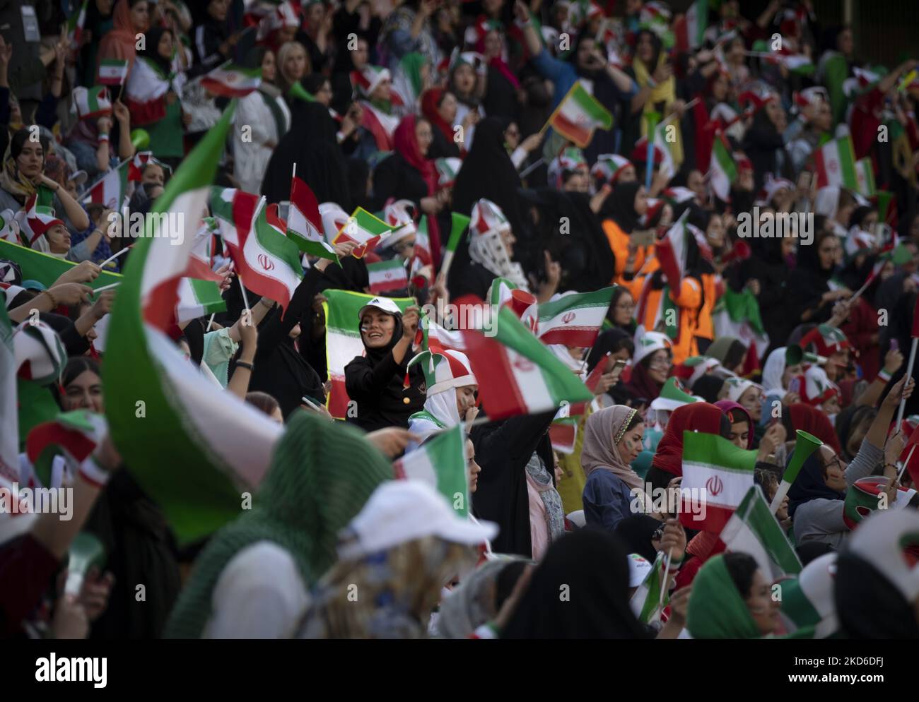 An Iranian soccer female fan waves an Iran flag at the Azadi (Freedom ...